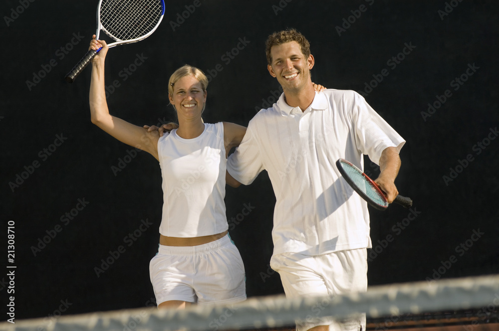 tennis partners skipping side by side arms around celebrating victory ...