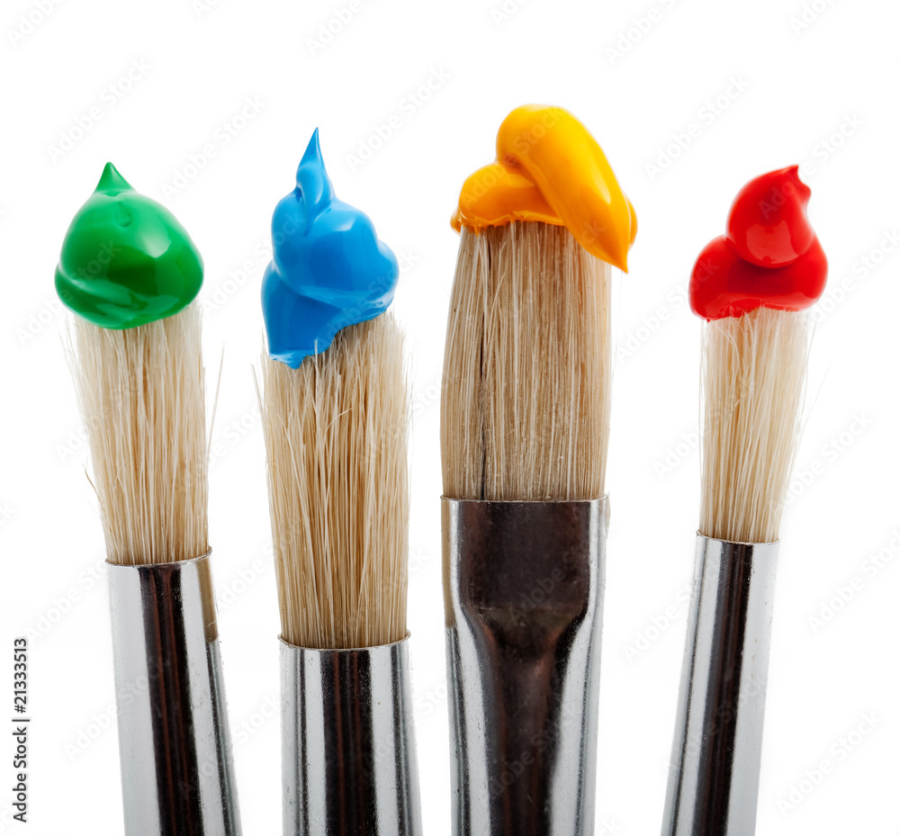 vier Pinsel mit Farbe Stock-Foto | Adobe Stock