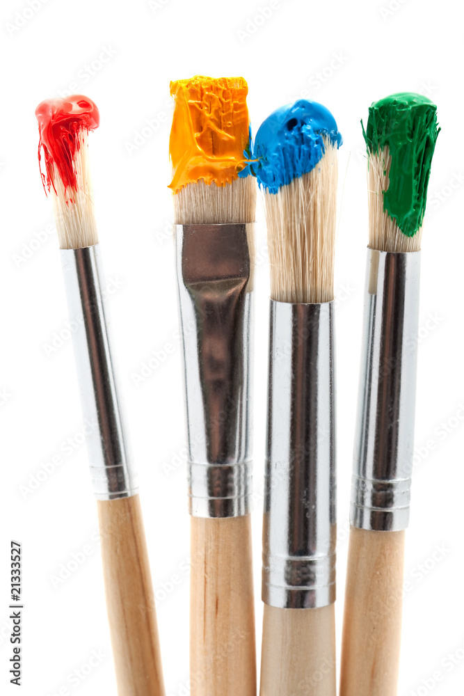 vier Pinsel mit Farbe Stock-Foto | Adobe Stock