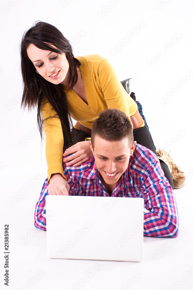 Teen girl and boy with white laptop computer Stock Photo | Adobe Stock
