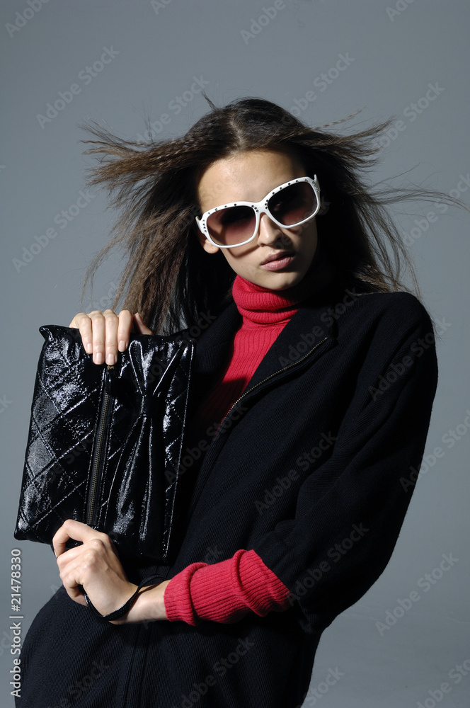 fashion model holding little purse Stock Photo | Adobe Stock