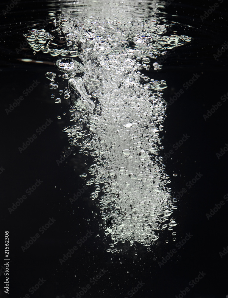 Swirling air bubble jet in black water Stock Photo | Adobe Stock