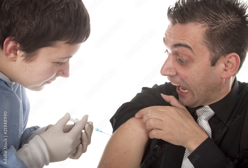 Nurse giving injection to scared patient Stock Photo | Adobe Stock