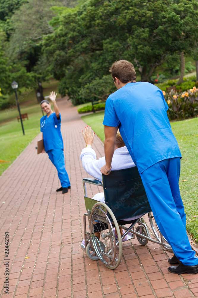 nurse waving goodbye to patient Stock Photo | Adobe Stock