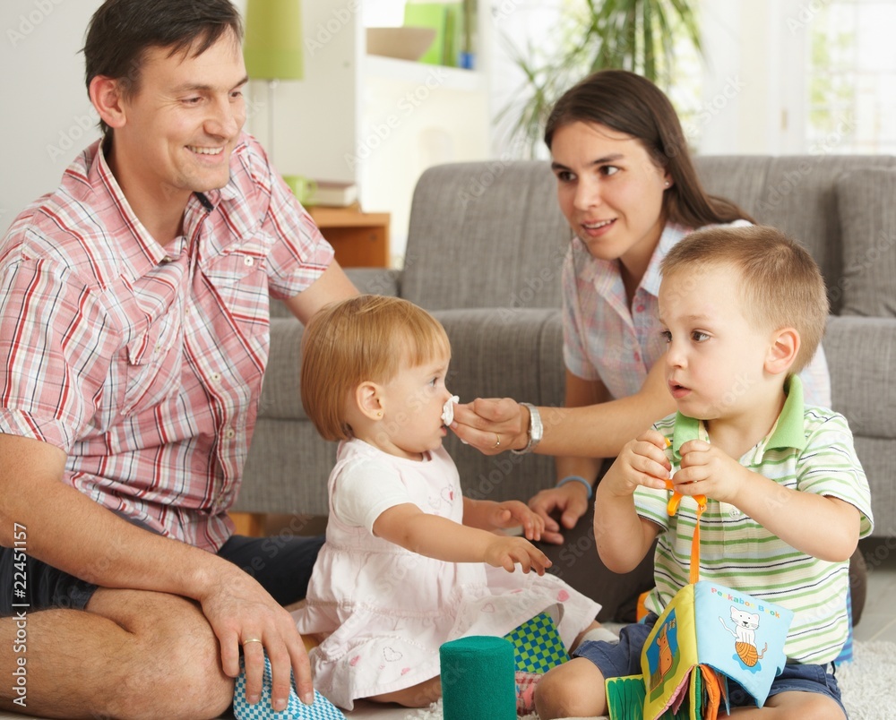 Happy nuclear family together at home Stock Photo | Adobe Stock