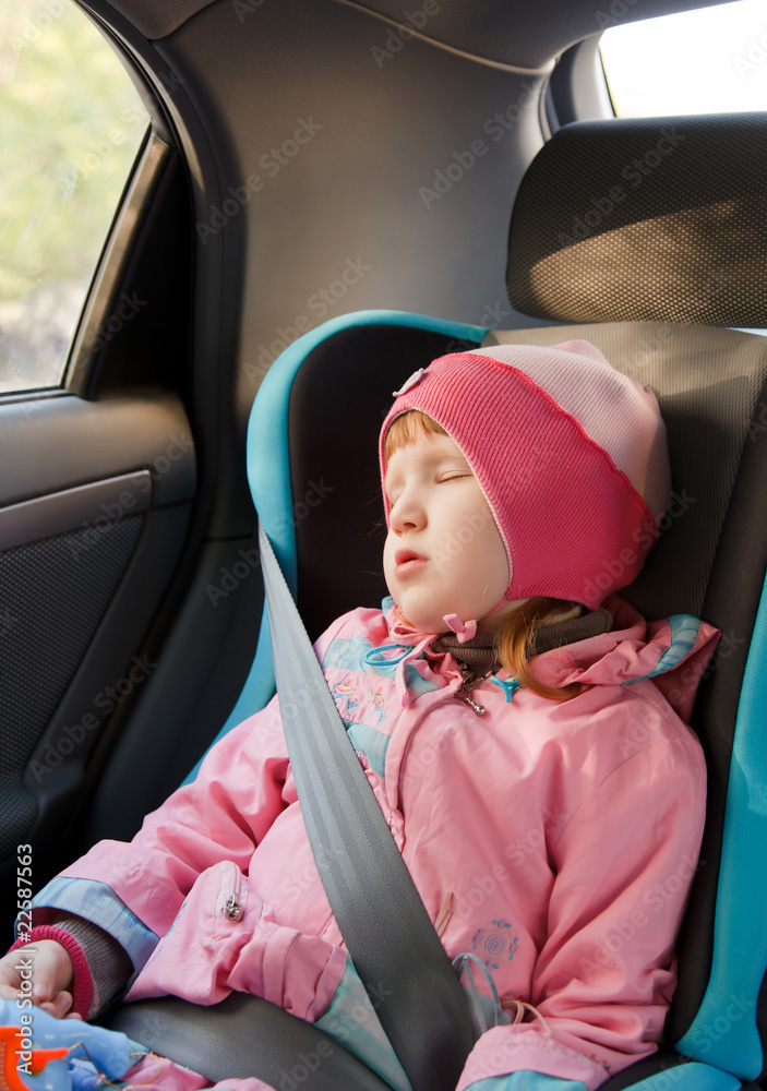 Cute little girl sleeping in a car Stock Photo | Adobe Stock