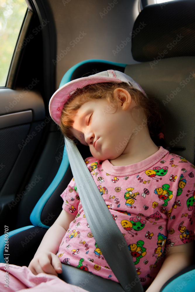 Cute little girl sleeping in a car Stock Photo | Adobe Stock