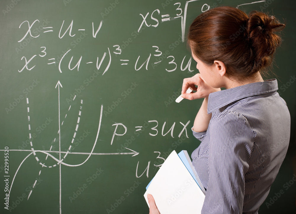 girl writing the mathematical formulas on a chalkboard Stock Photo ...