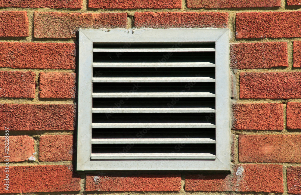 Modern new air vent cemented into a brick wall Stock Photo | Adobe Stock