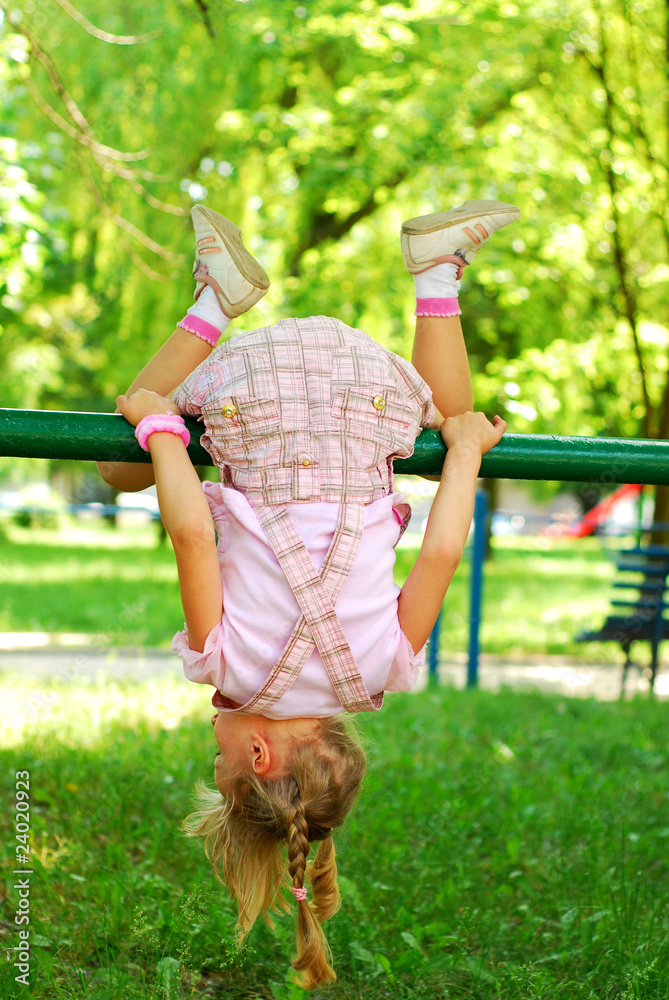 young girl doing somersault Stock Photo | Adobe Stock