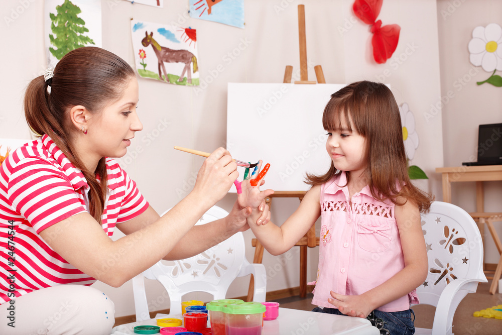 Child making handprints. Stock Photo | Adobe Stock