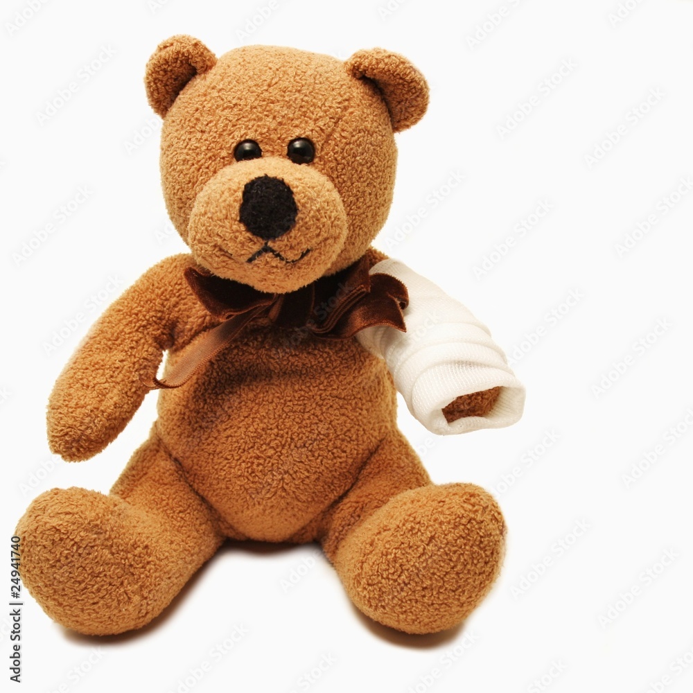 Teddy mit verletztem Arm Stock-Foto | Adobe Stock
