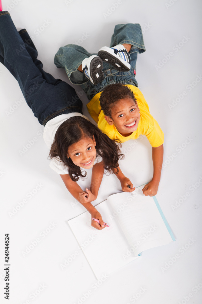overhead of happy kids coloring in together Stock Photo | Adobe Stock