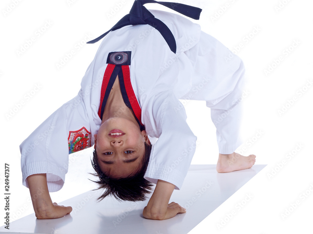 smiling boy doing backbend exercise isolated on white Stock Photo ...