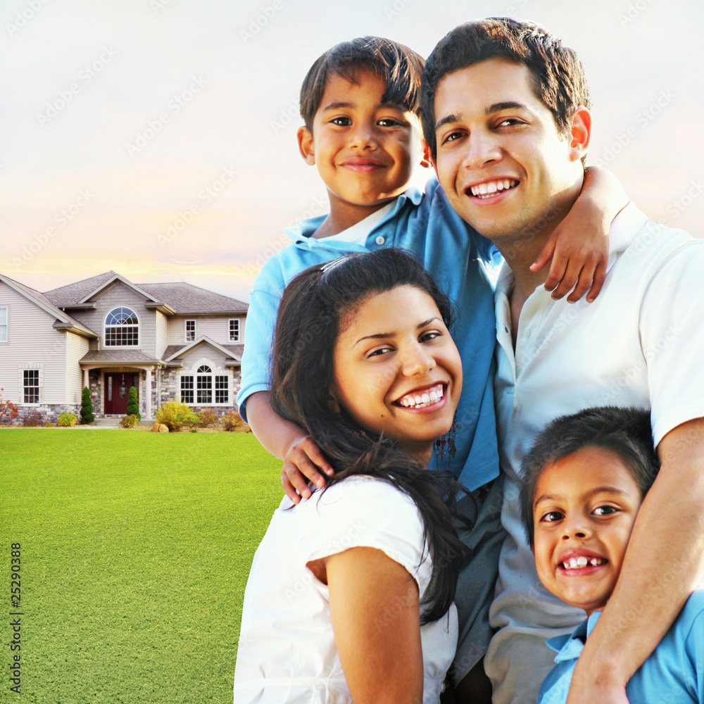 Happy Indian Family In Front Of House