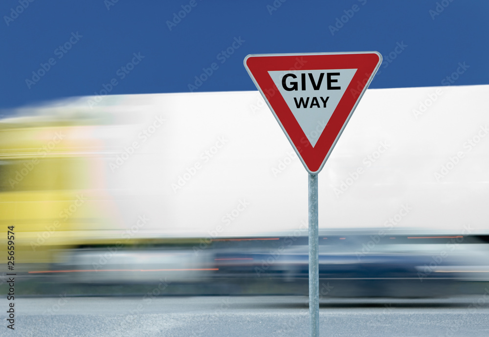 Give way yield traffic sign and truck Stock Photo | Adobe Stock