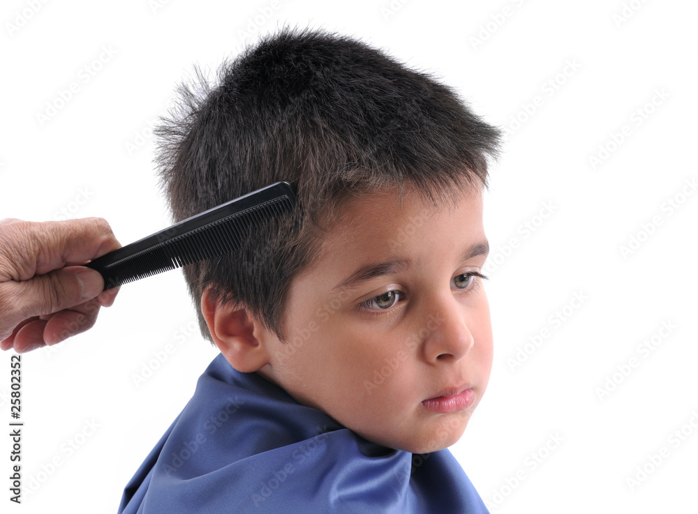 Cute boy having haircut isolated on white background. Stock Photo ...