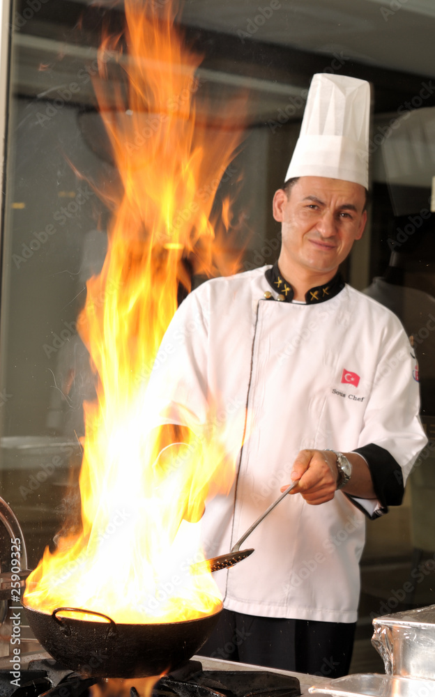 Chef cooking flambe dish. Stock Photo | Adobe Stock