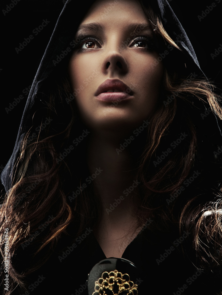 Portrait of a mysterious woman in hood Stock Photo | Adobe Stock