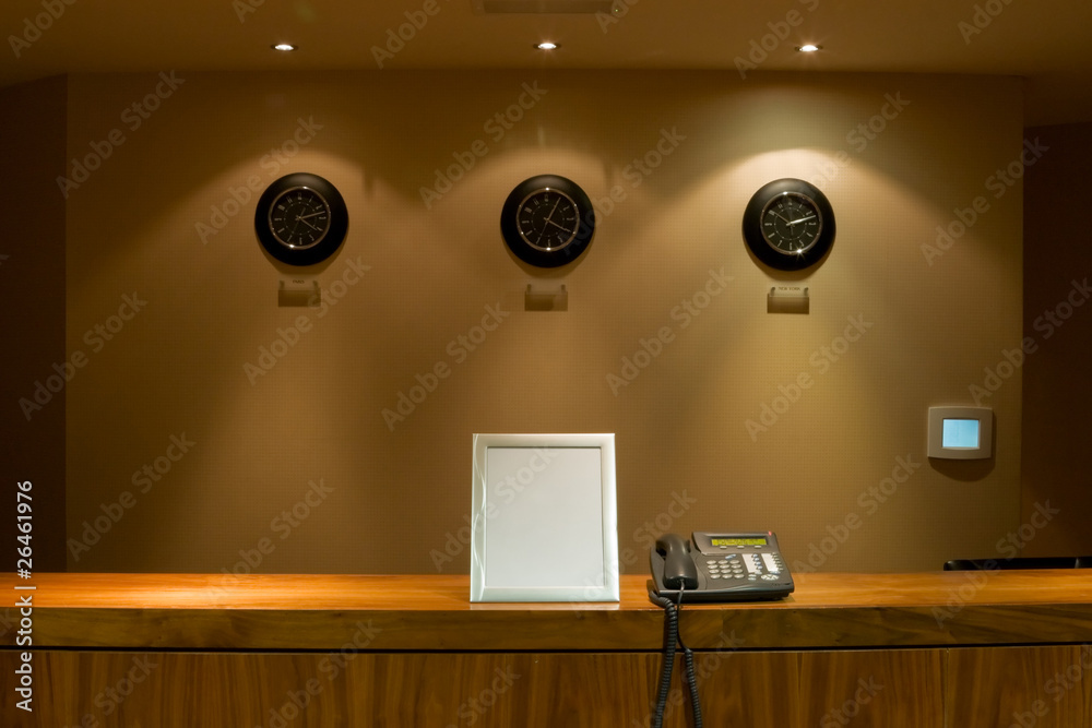 hotel reception desk with phone and signboard Stock Photo | Adobe Stock