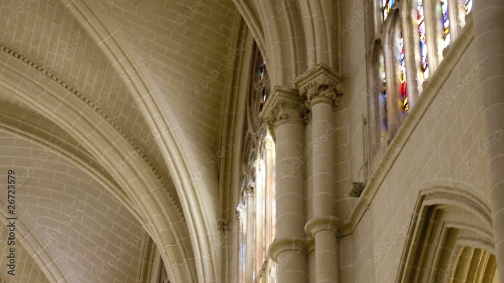 Gothic cathedral interior featuring arched ceilings and stained glass ...