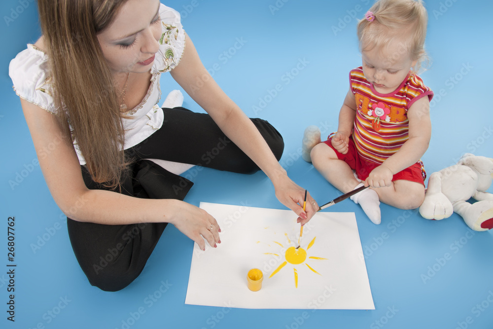 Cute little girl and mother drawing Stock Photo | Adobe Stock