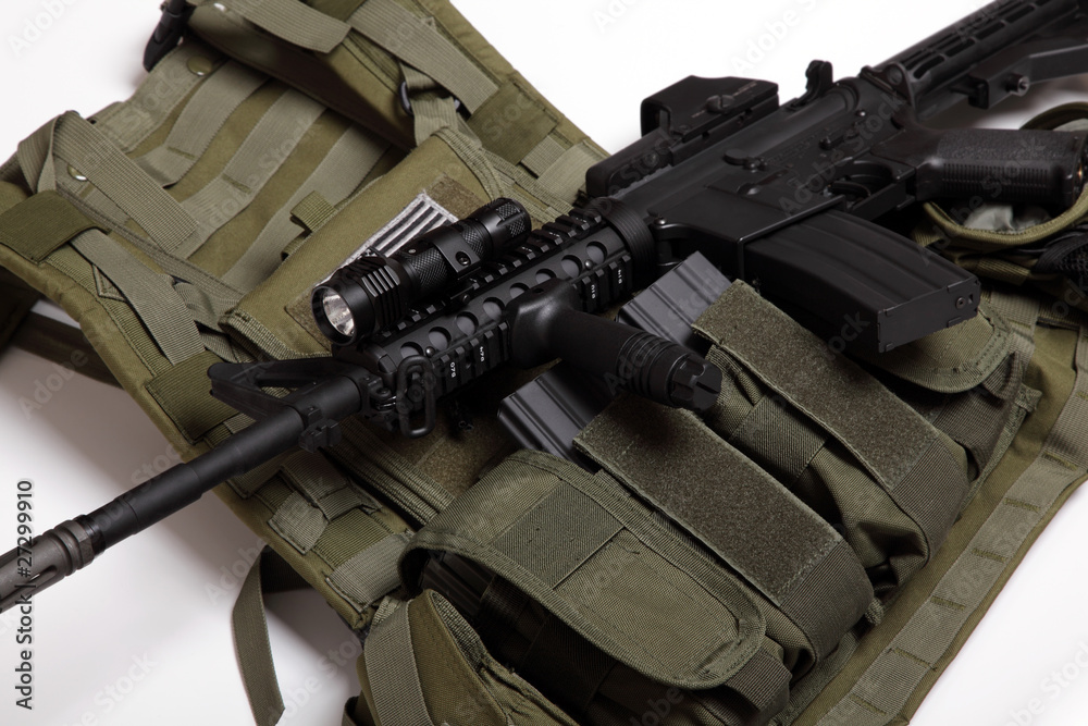 Military concept. Tactical vest and assault rifle. Stock Photo | Adobe ...