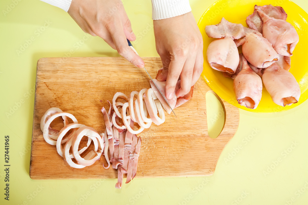 slicing of boiled squid. Stages of cooking squid see in series Stock ...