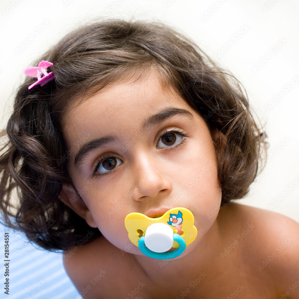 bambina con ciuccio Stock Photo | Adobe Stock