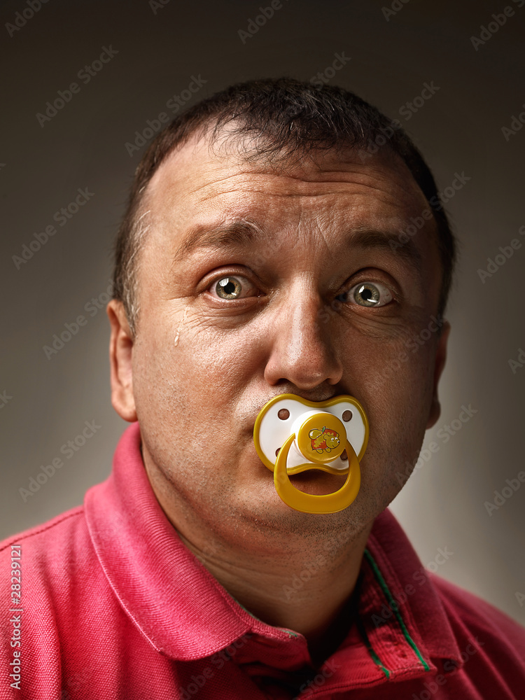 Adult Man with Pacifier Stock Photo | Adobe Stock
