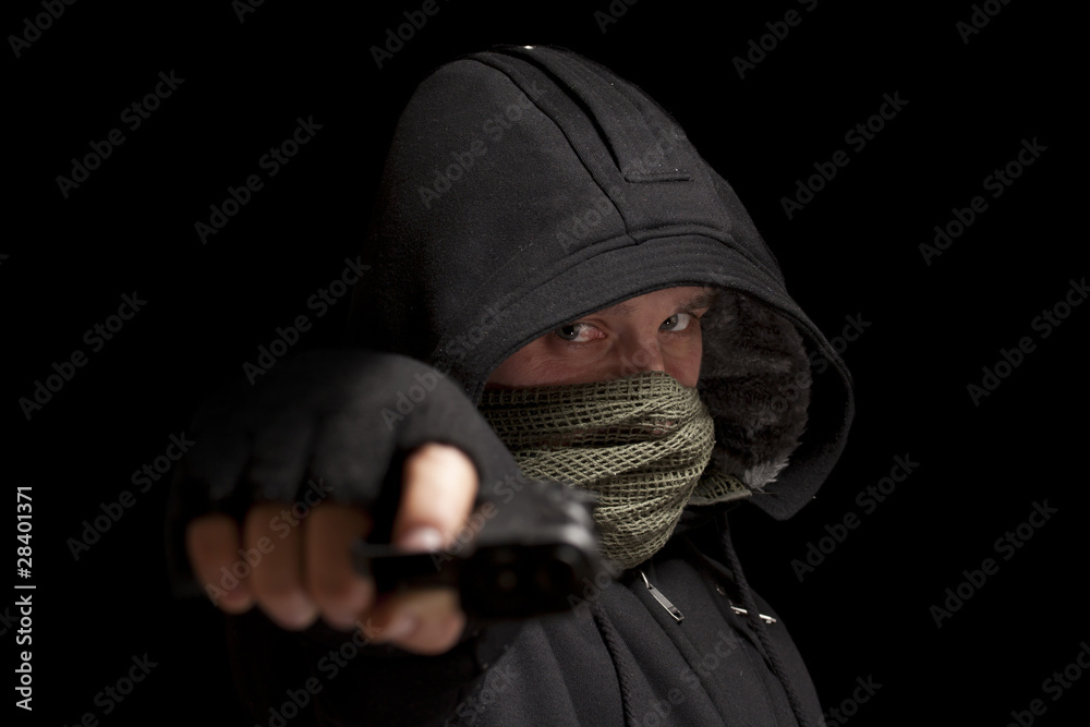 Thief with gun Stock Photo | Adobe Stock