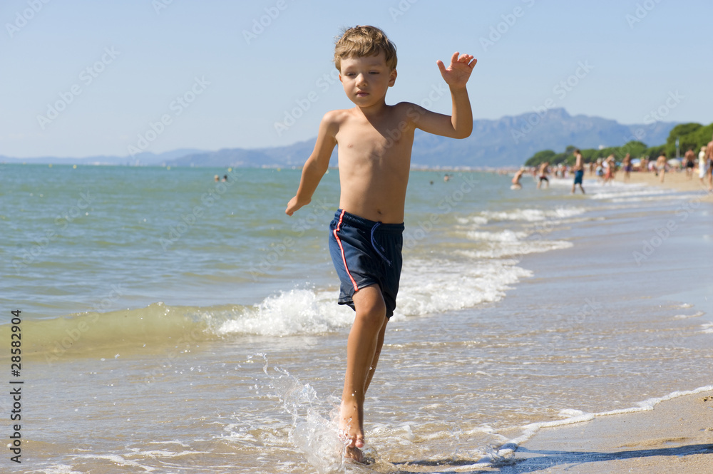 boy on beach Stock Photo | Adobe Stock