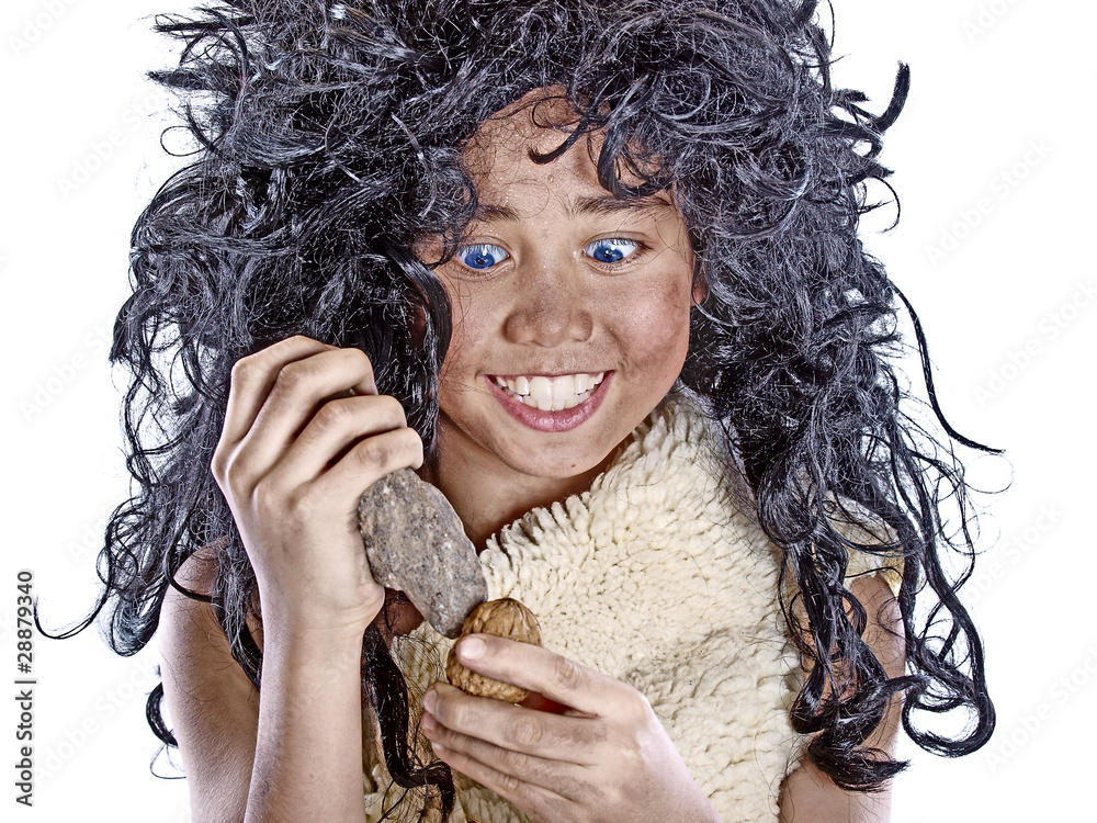 smiling neanderthal child cracking walnuts with stone Stock Photo ...