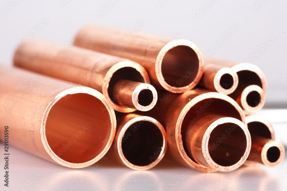 Set of copper pipes of different diameter lying in one heap Stock Photo ...