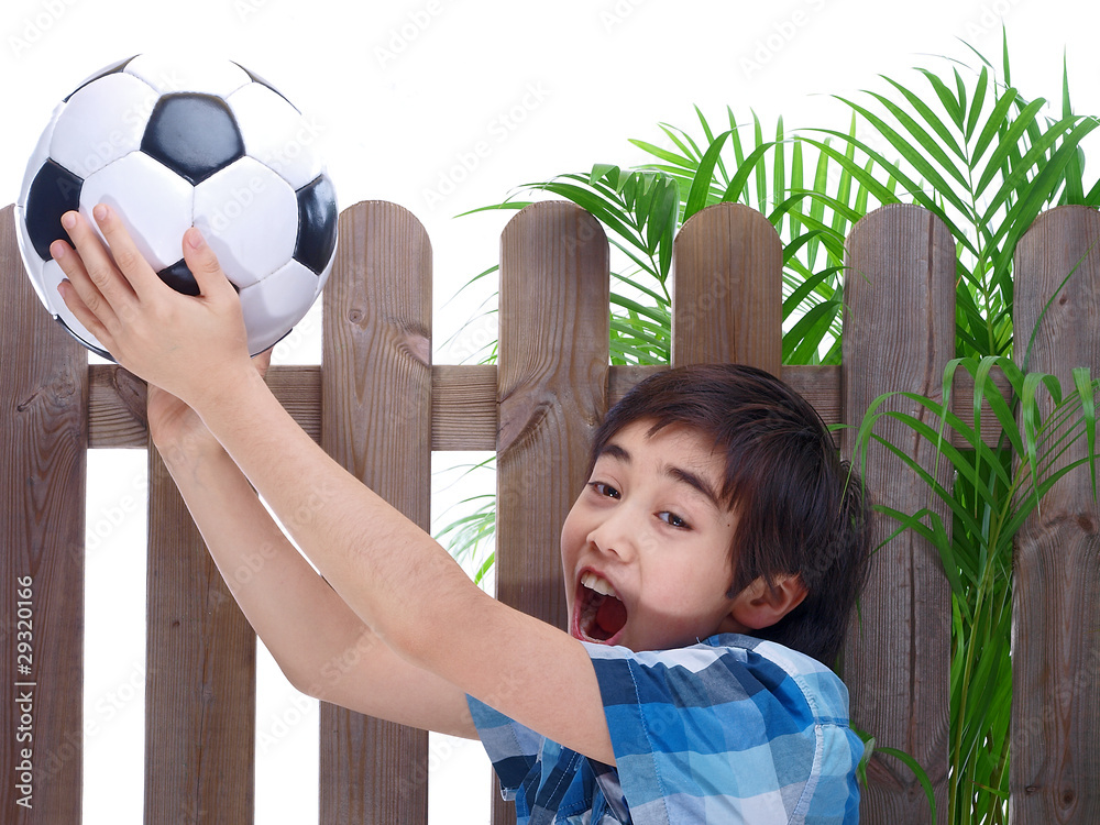 smiling boy catching a ball from the neighbors Stock Photo | Adobe Stock