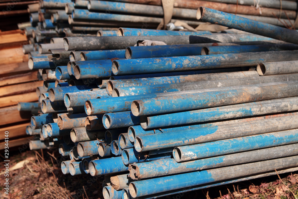 Pile of rusting scaffolding pipes Stock Photo | Adobe Stock
