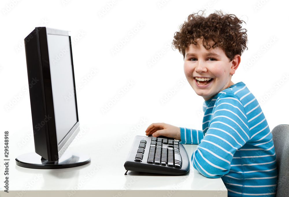 Boy using computer isolated on white background Stock Photo | Adobe Stock