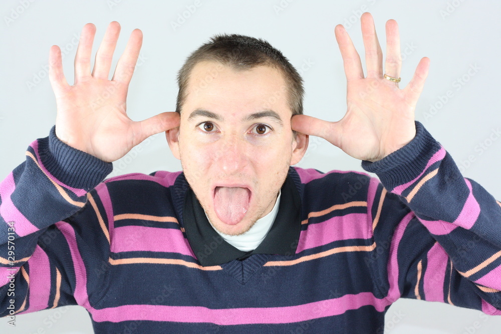 Homme qui fait la grimace Photos | Adobe Stock