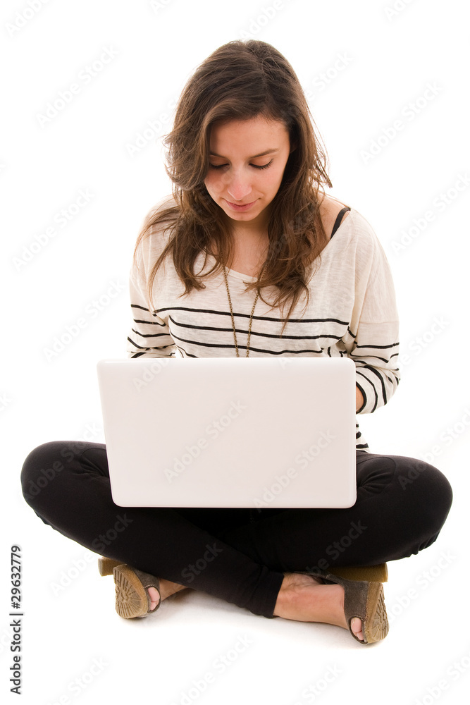 Young woman working on a laptop isolated over a white background Stock ...