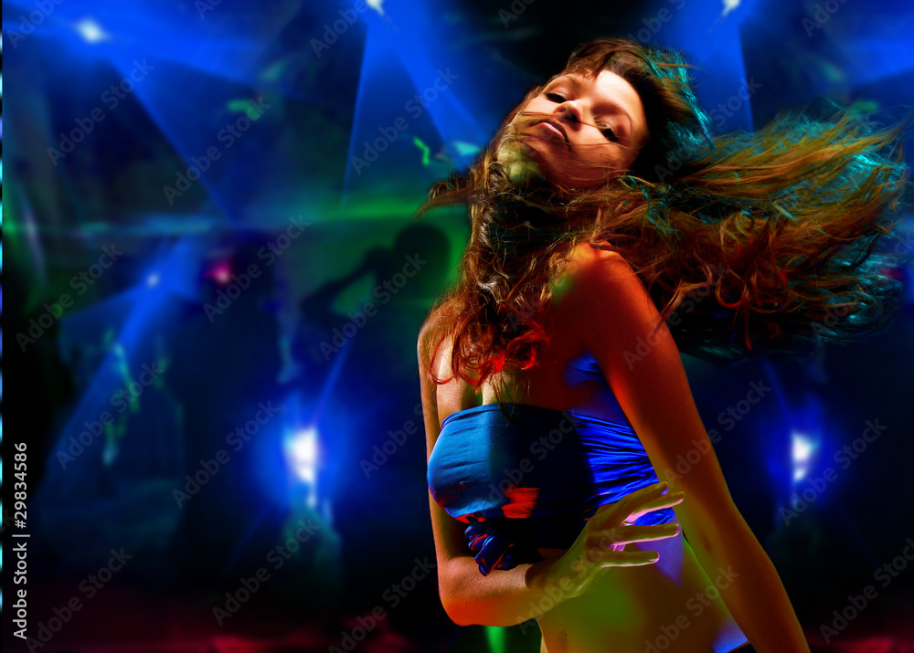 Beautiful young woman dancing in the nightclub Stock Photo | Adobe Stock