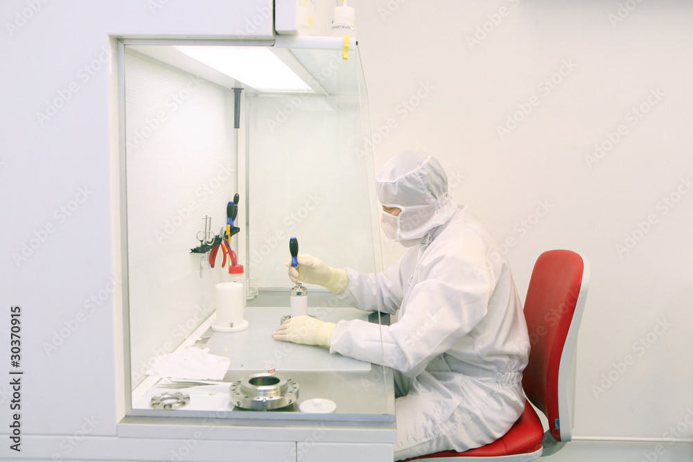 technician working in a clean room in laboratory Stock Photo | Adobe Stock