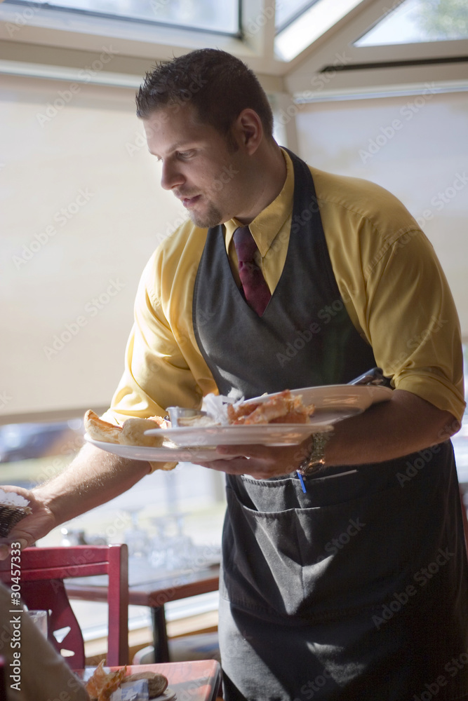 Waiter cleaning table Stock Photo | Adobe Stock
