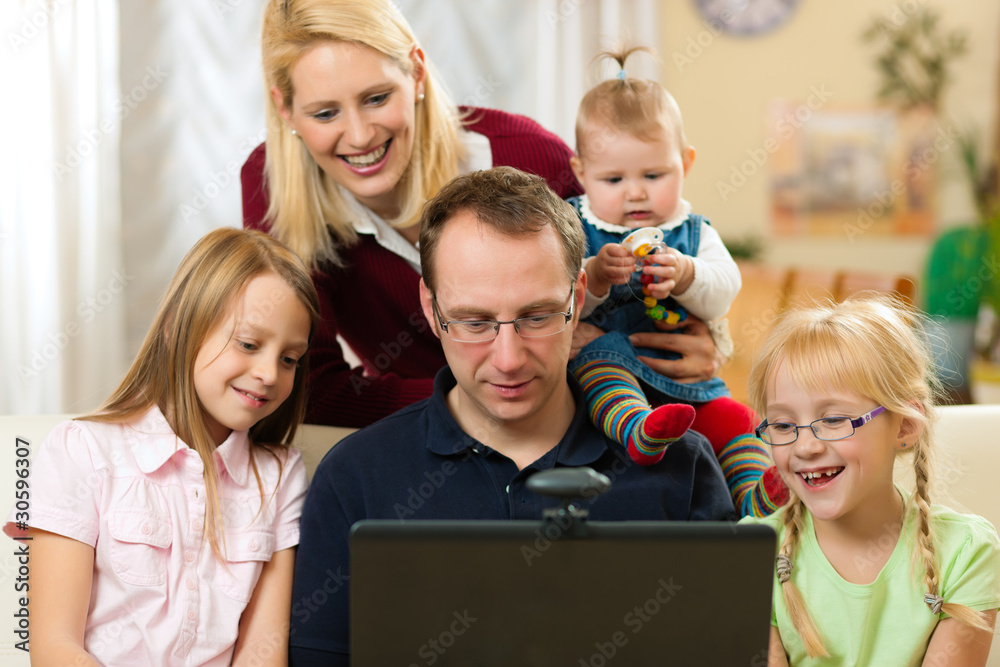 Family with computer having video conference Stock Photo | Adobe Stock