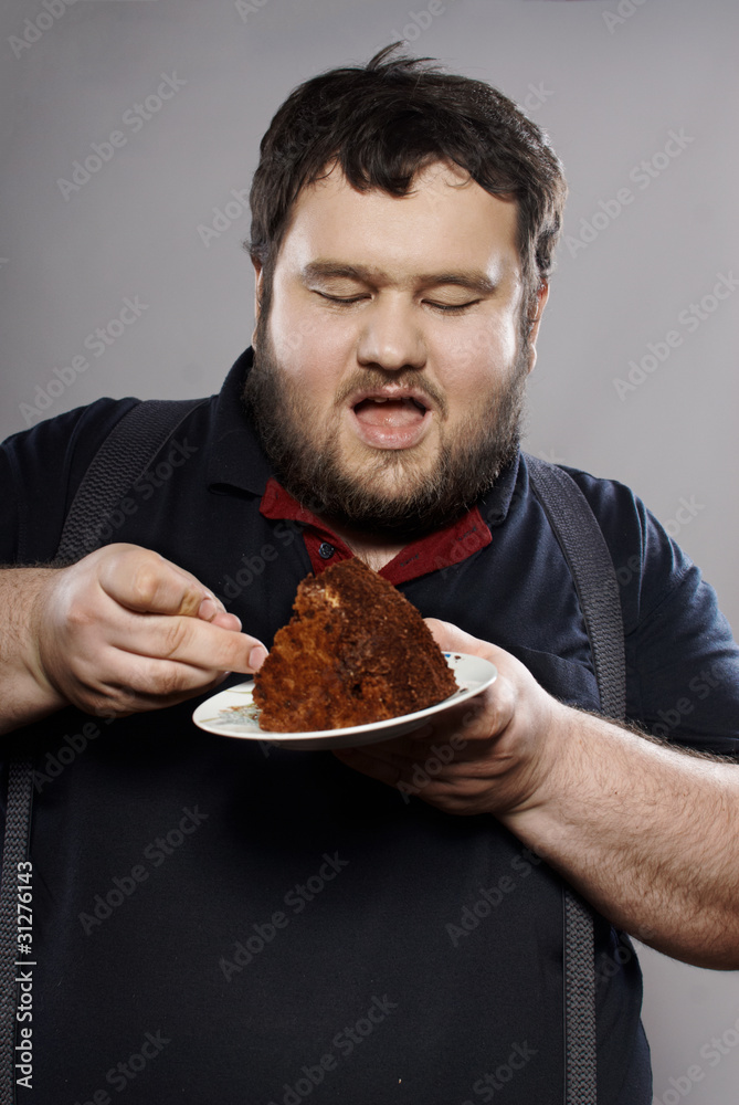 funny fat guy eating chocolate cake Stock Photo | Adobe Stock
