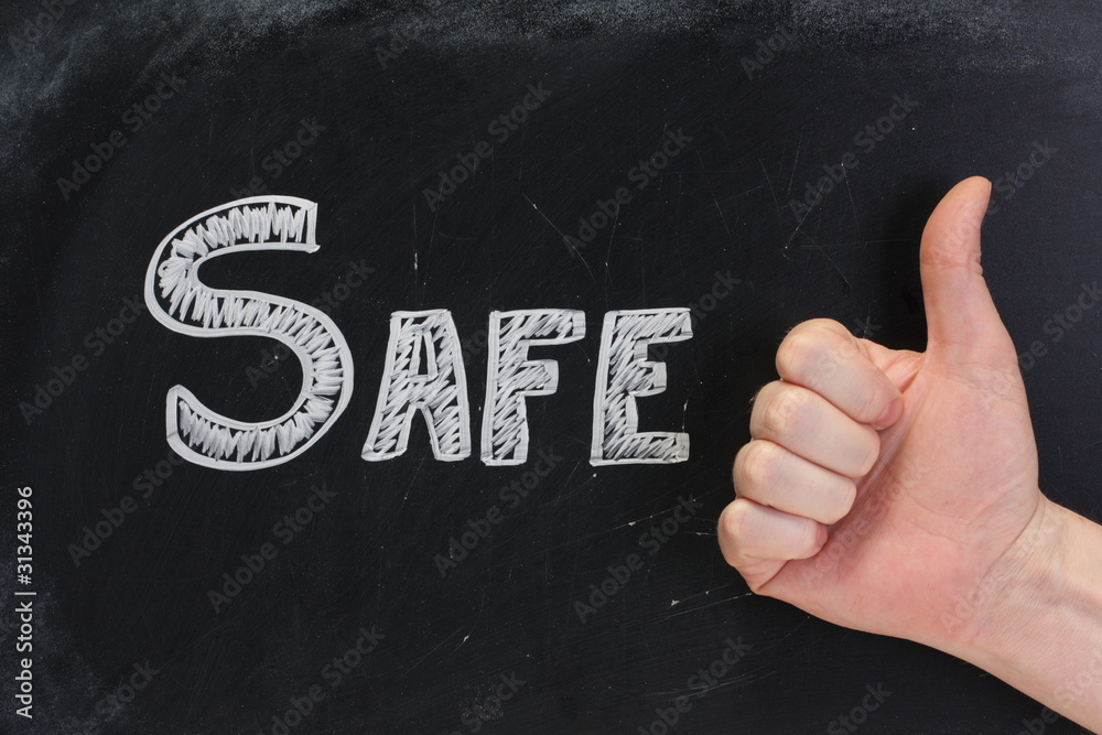 Thumbs up sign for the word Safe on a Blackboard Stock Photo | Adobe Stock