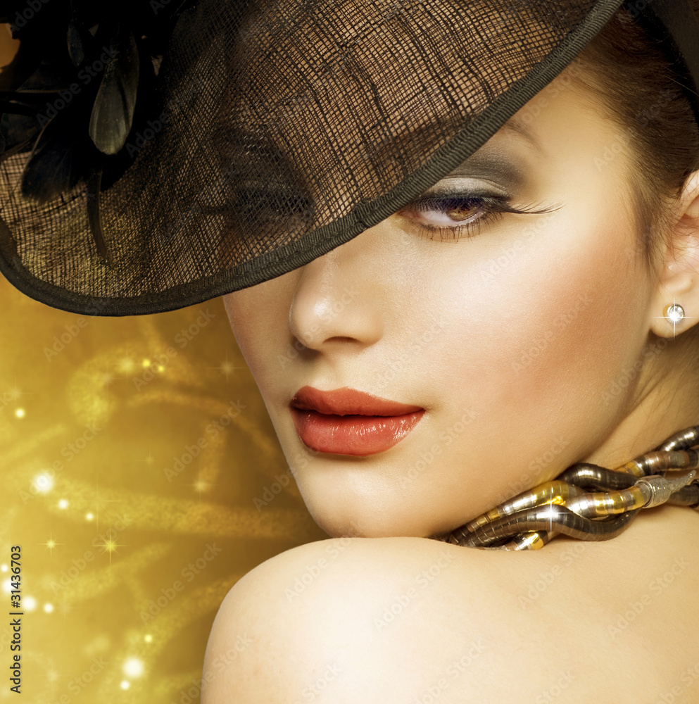 Beautiful Woman over luxury gold background Stock Photo | Adobe Stock