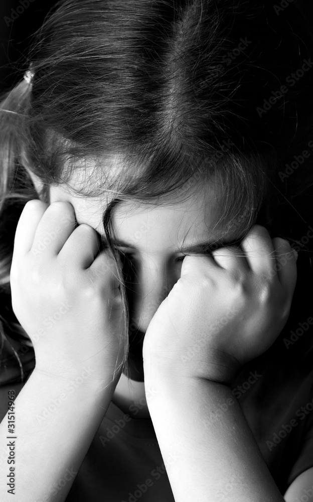 Monochromatic image of a sad girl crying on a black background Stock ...