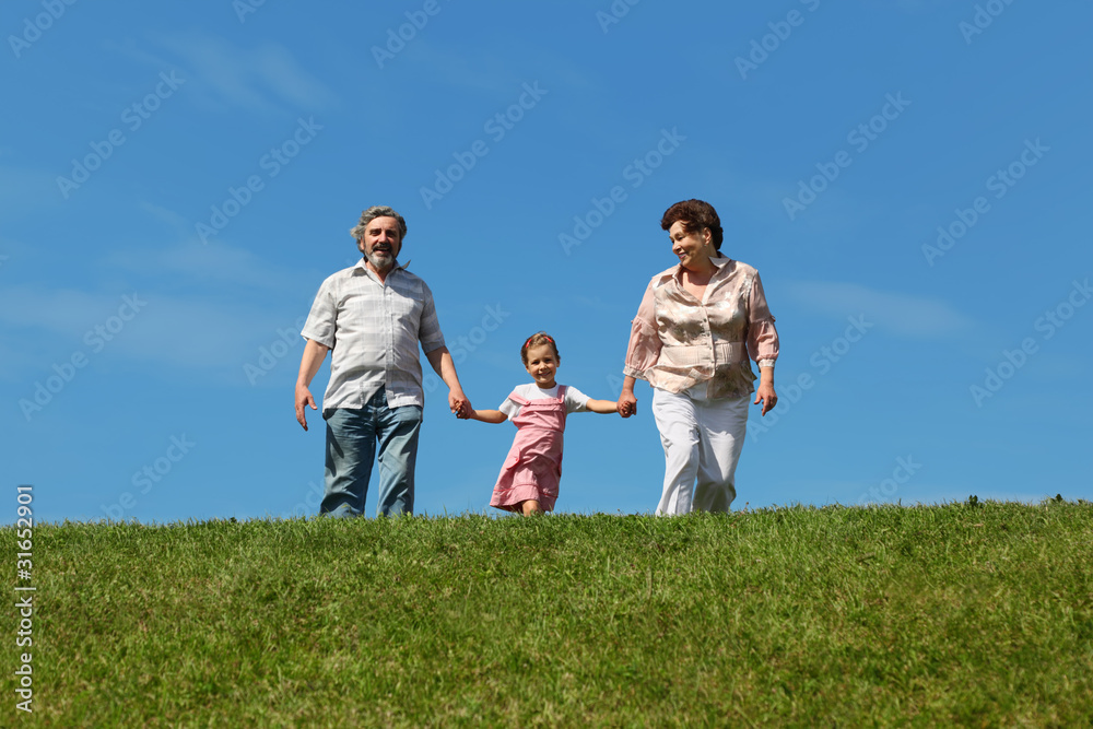 little girl and her grandparents running on hill Stock Photo | Adobe Stock