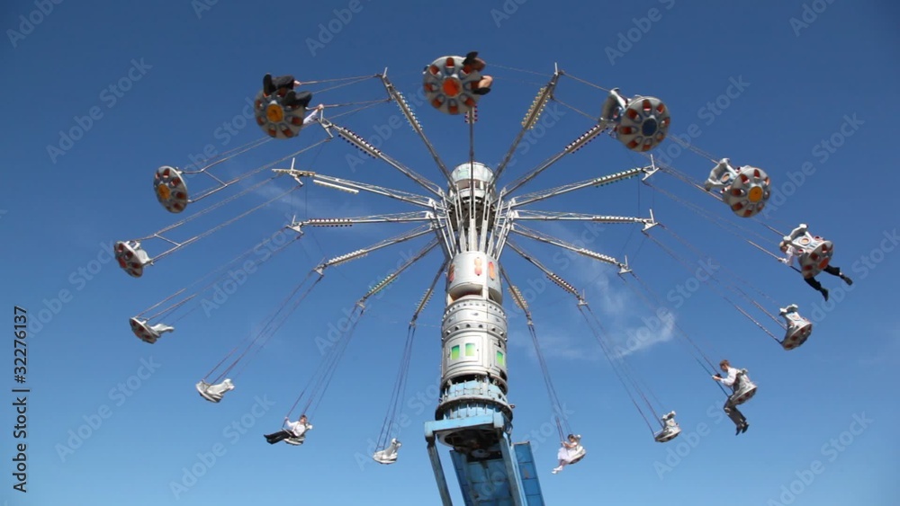 Merry-go-round on blue sky background at sunny day. Stock Video | Adobe ...