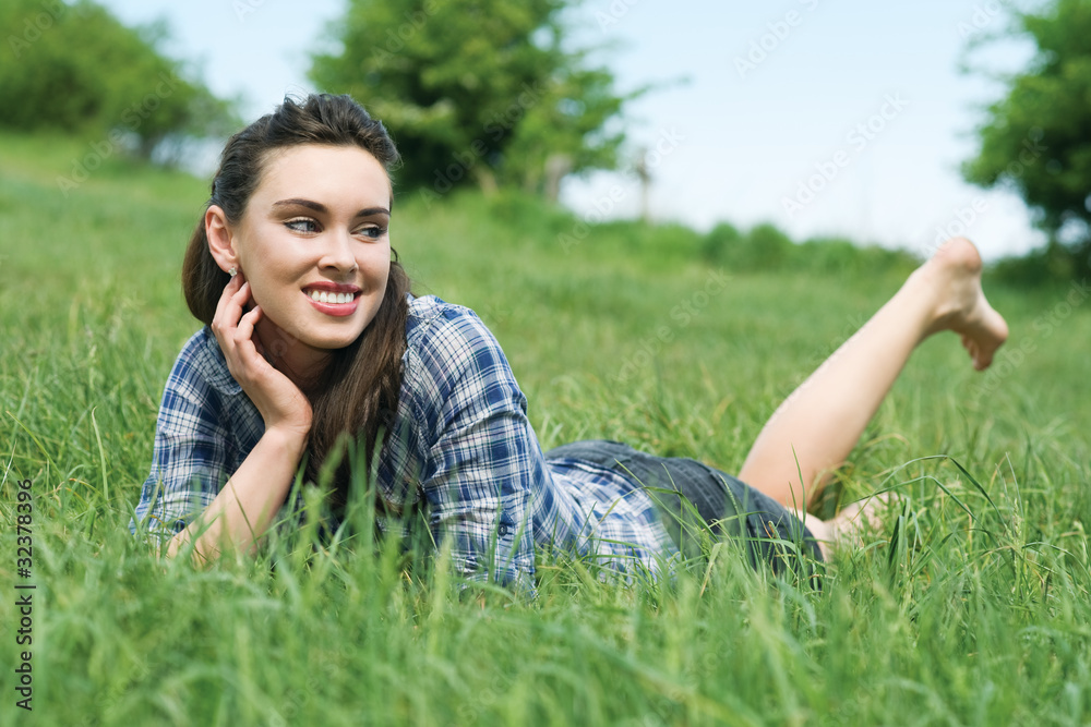 Portrait of beautiful young barefoot woman in nature Stock Photo ...